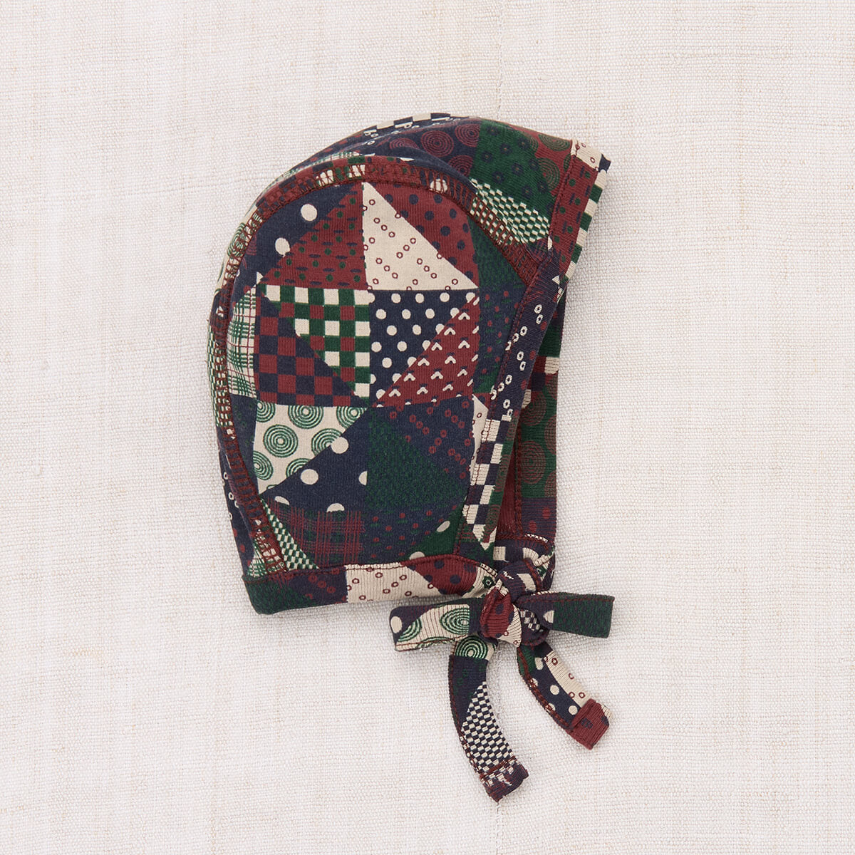 Baby Pima Bonnet in Madder Root Patchwork by Misha & Puff – Junior Edition